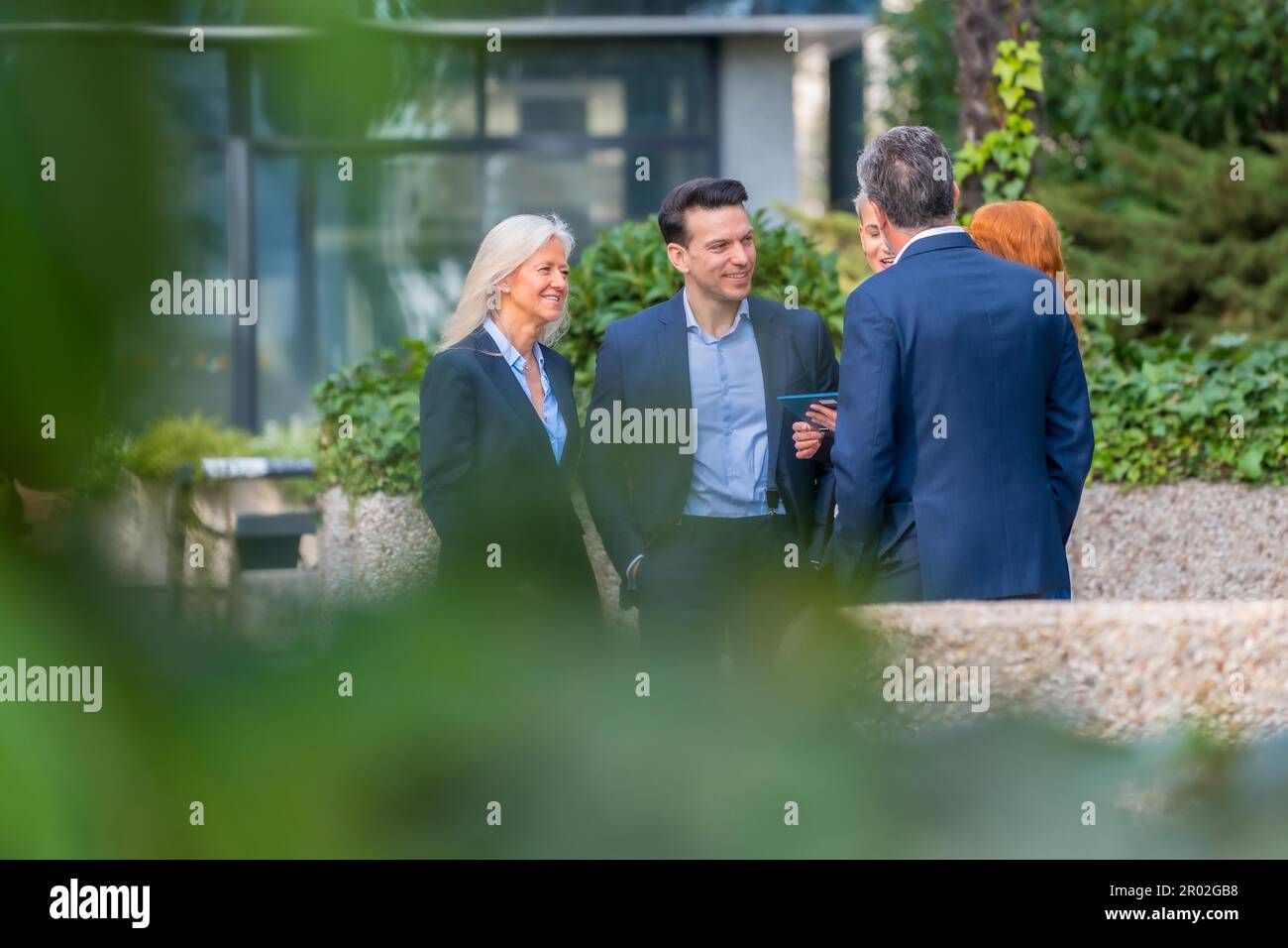 Executive Conversation Among Trees in Commercial Building Area Stock ...