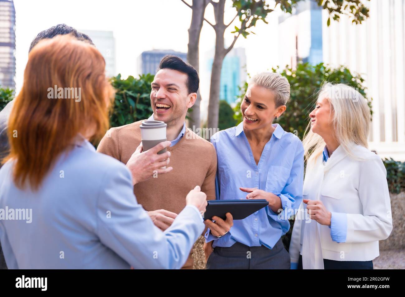 Female coworkers laughing hi-res stock photography and images - Alamy