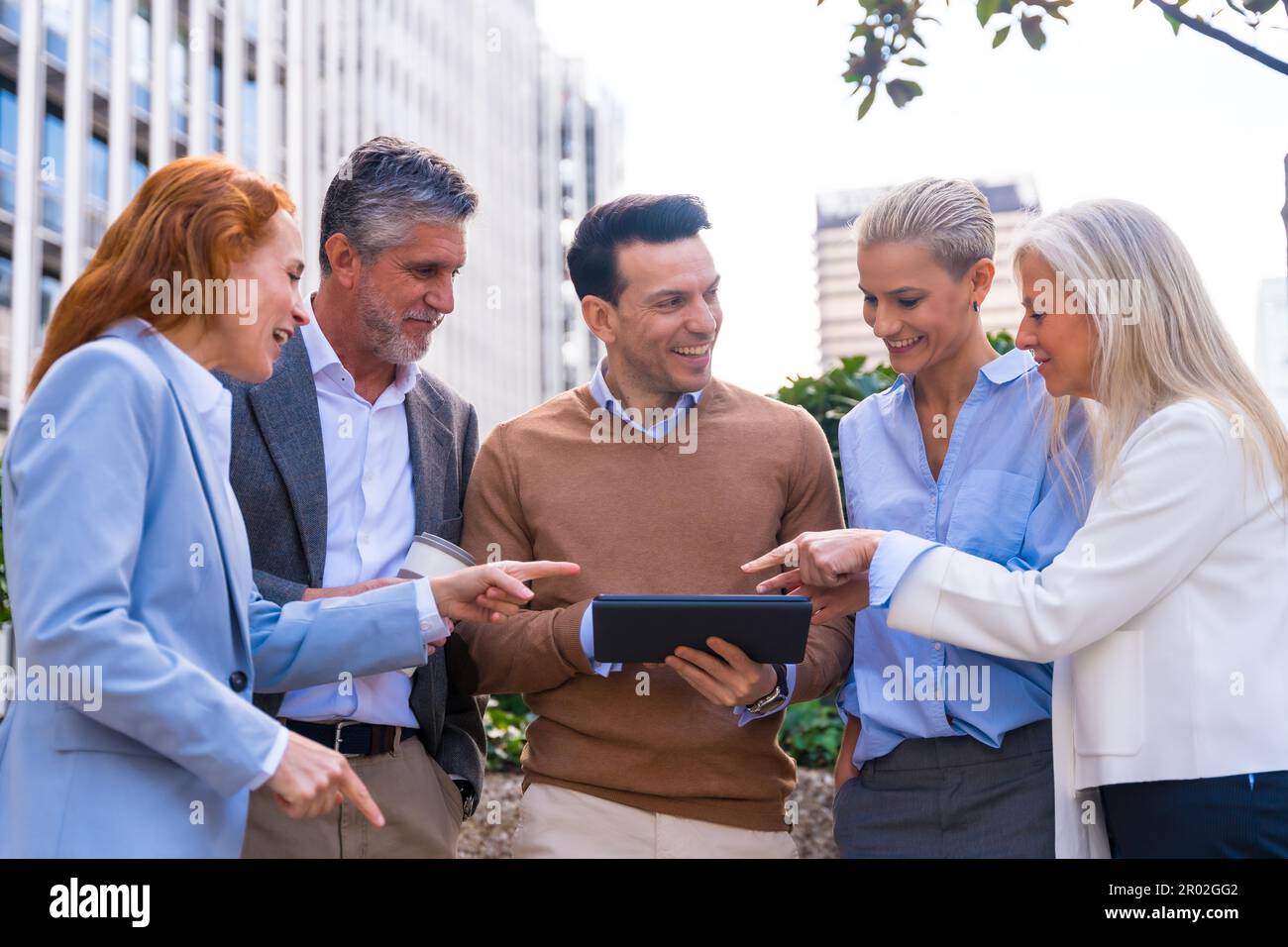 Group of co workers laughing hi-res stock photography and images - Alamy