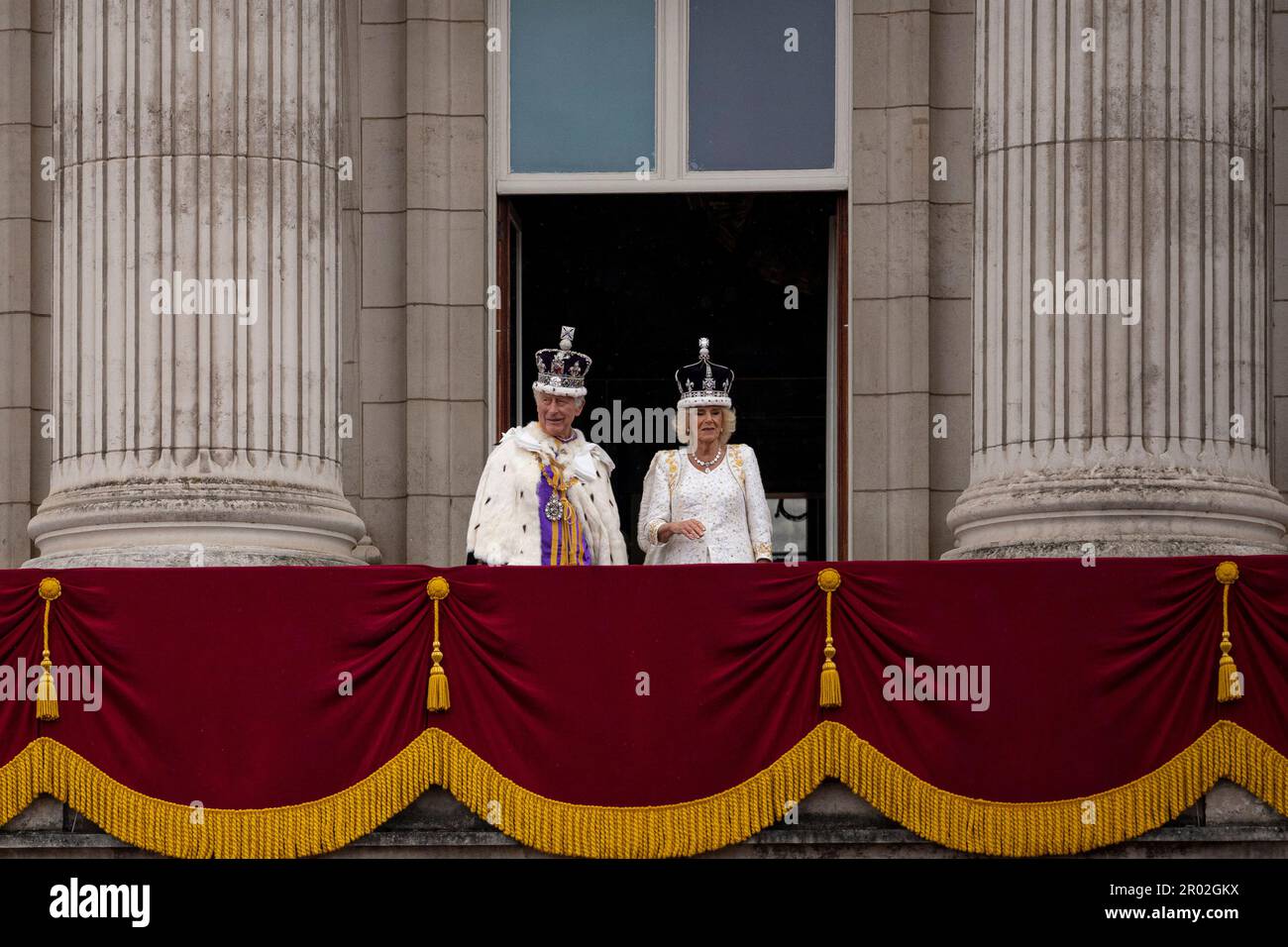 Britain's King Charles III and Queen Camilla wave to the crowds from ...