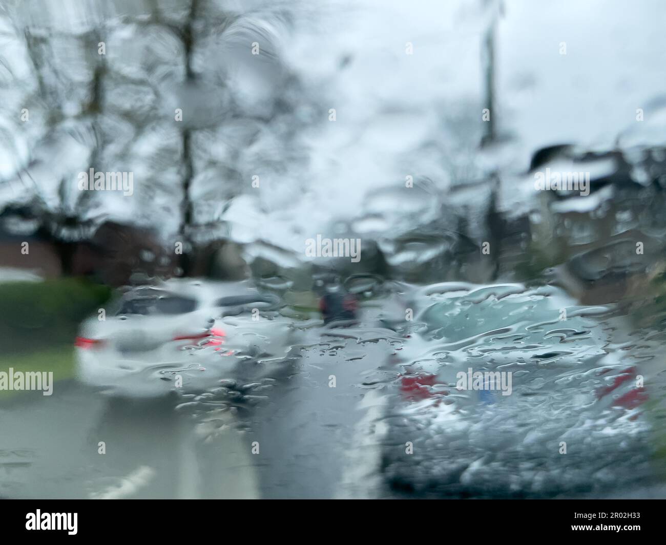 View through windscreen of car in heavy rain in dangerous situation in ...