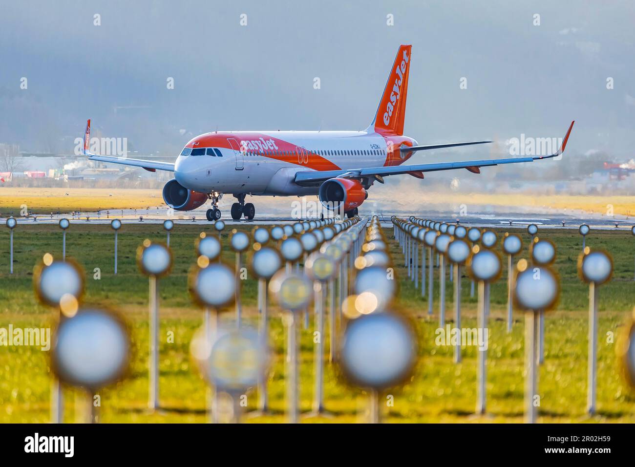 Aircraft on the tarmac, airfield lighting, easyJet, Airbus A320-200 ...