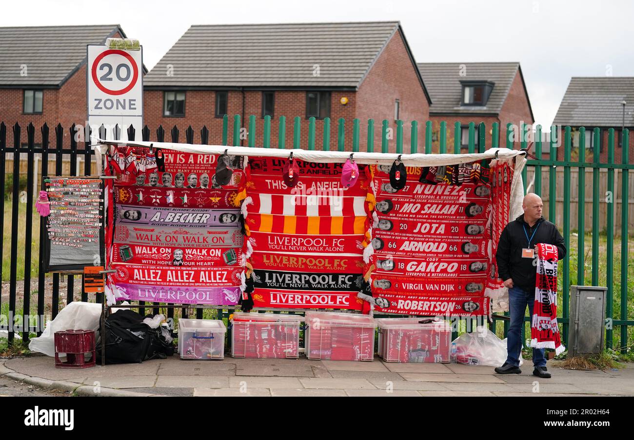 A street vendor sells merchandise ahead of the Premier League match at ...