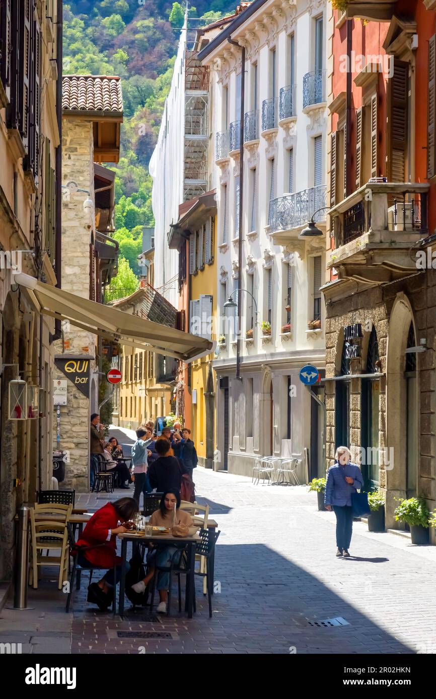 People in an old town alley, Como, Lake Como, Lombardy, Italy Stock ...