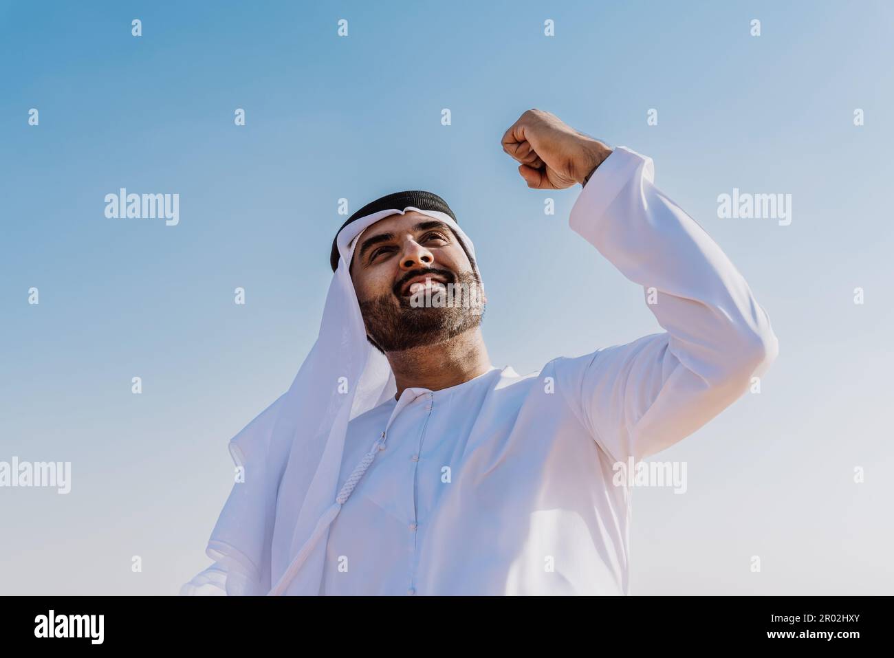 Handsome and successful middle-eastern man wearing traditional emirati ...