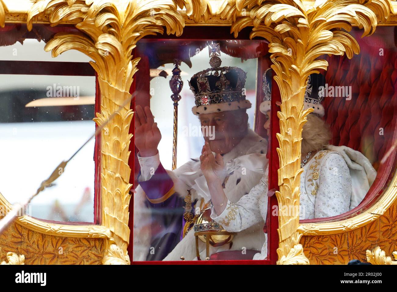 His Royal Highness King Charles III waves while en-route to Buckingham ...