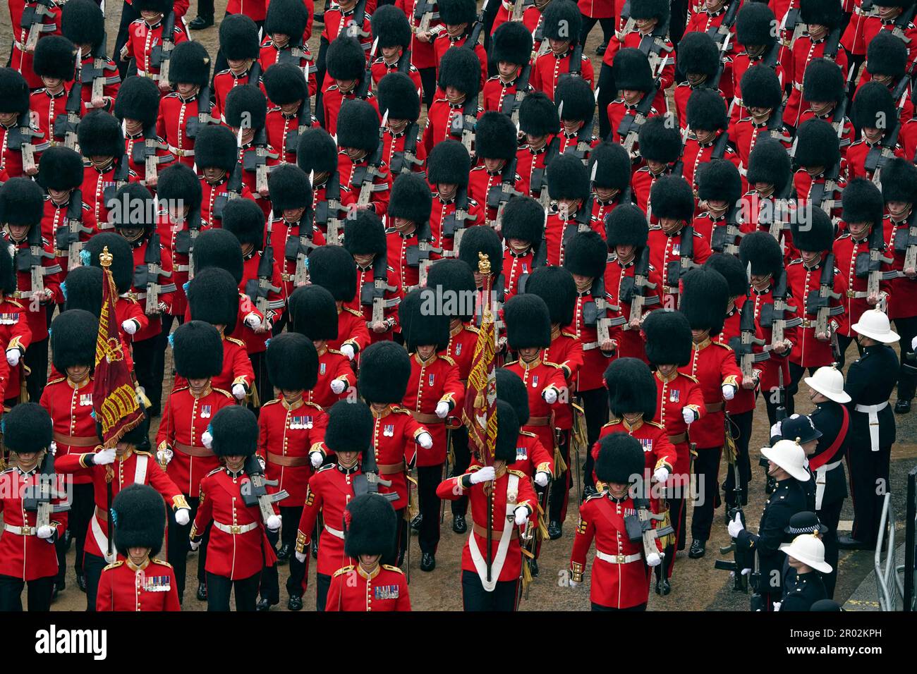 Military personnel march down the Mall in the King's Procession ahead ...