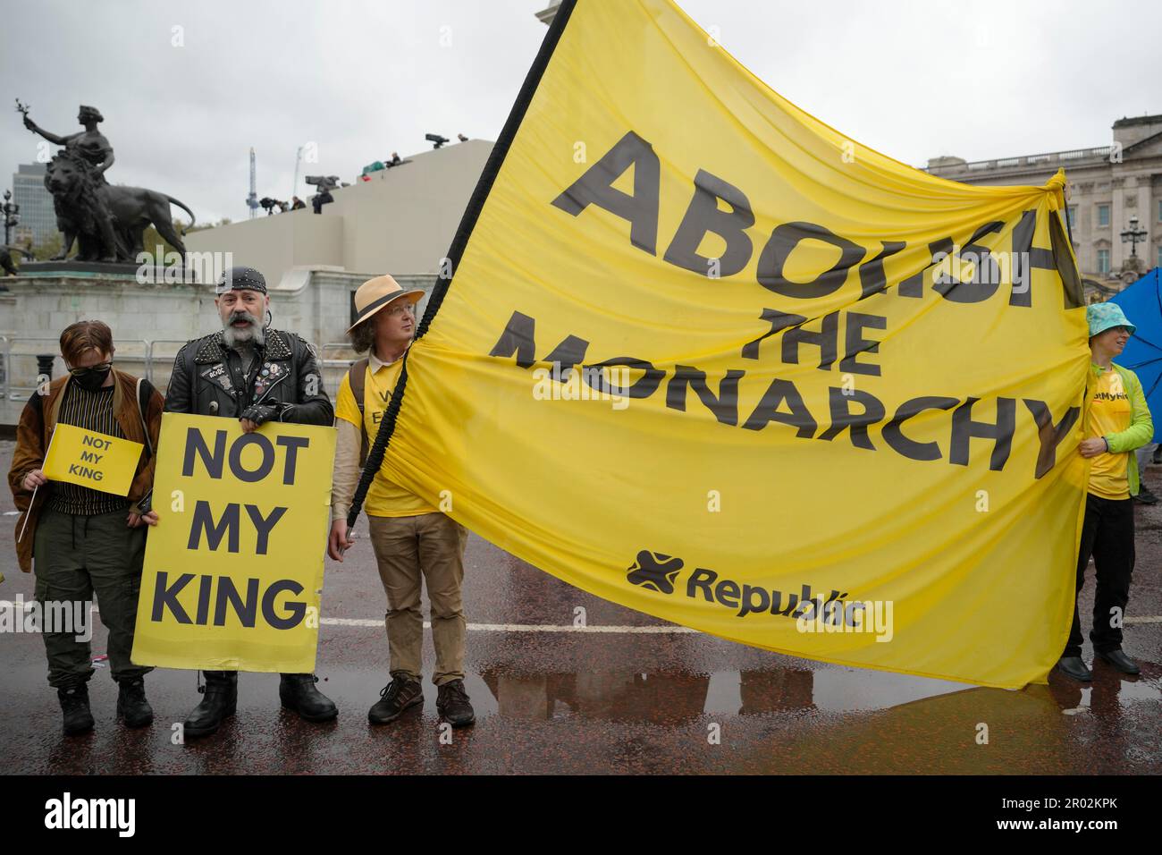 An anti-monarchy protesters hold banners and chant slogans near ...