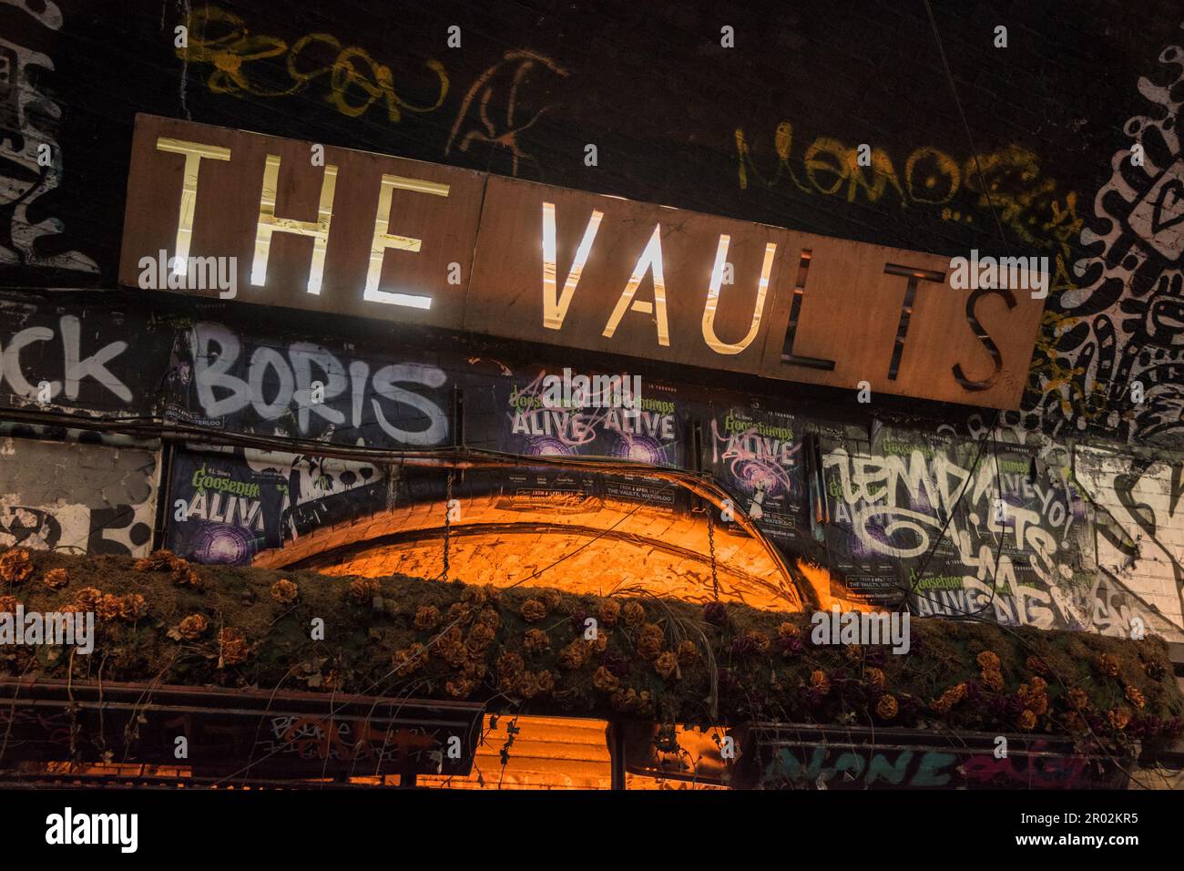 Neon sign of "The vaults" in the subway tunnel Stock Photo - Alamy