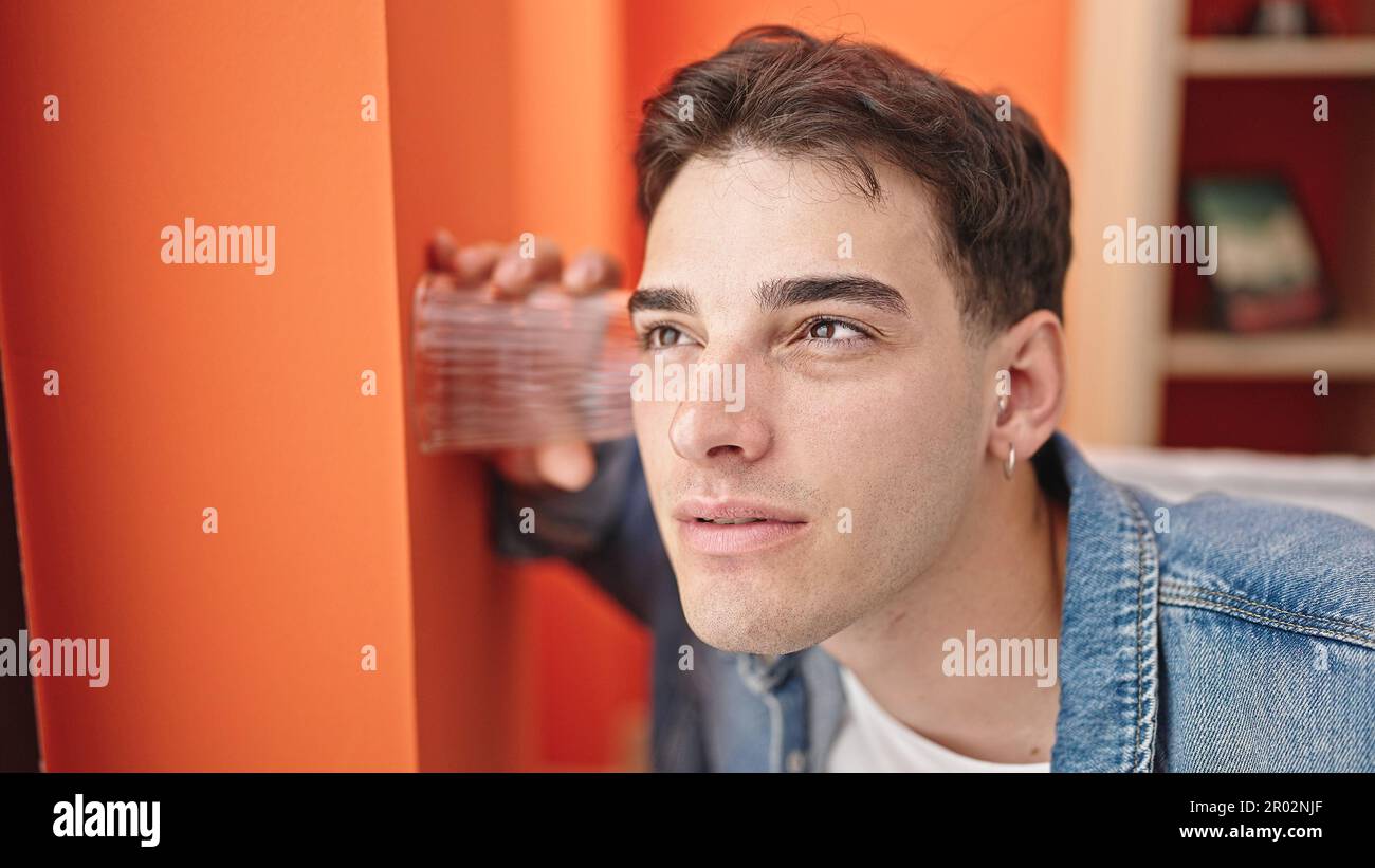 Spying glass to wall hi-res stock photography and images - Alamy