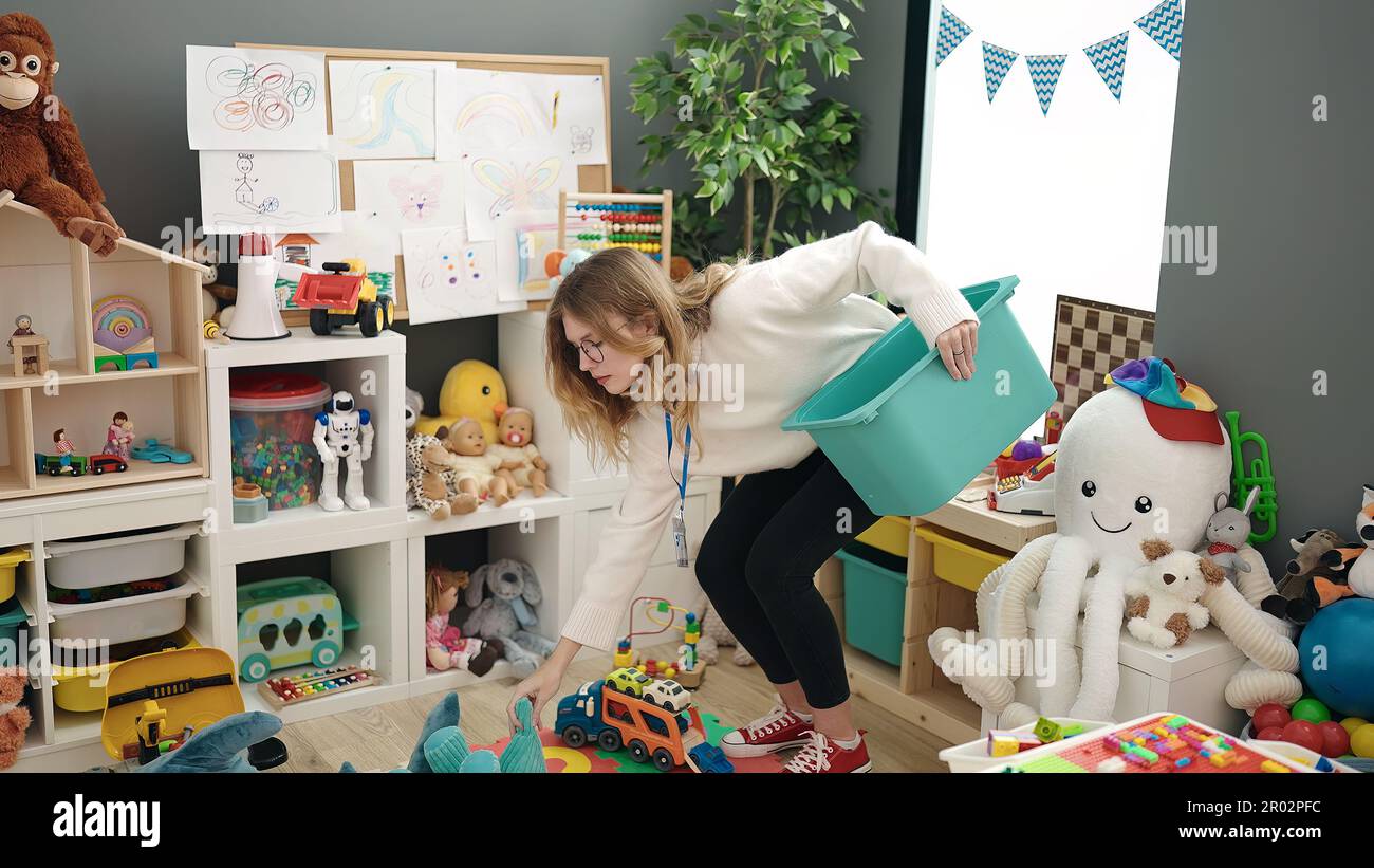 Picking up toys hi-res stock photography and images - Alamy