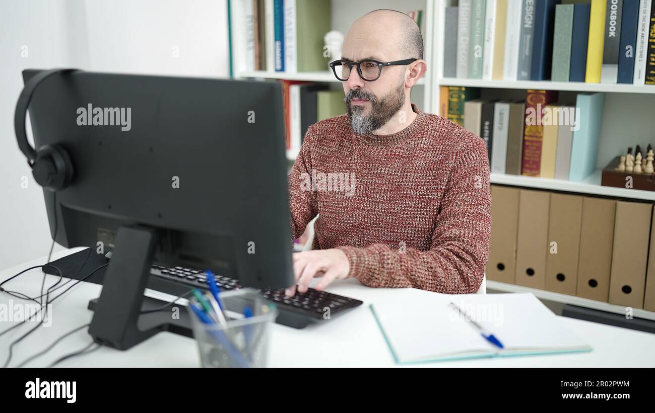 Bald young adult man glasses hi-res stock photography and images - Alamy