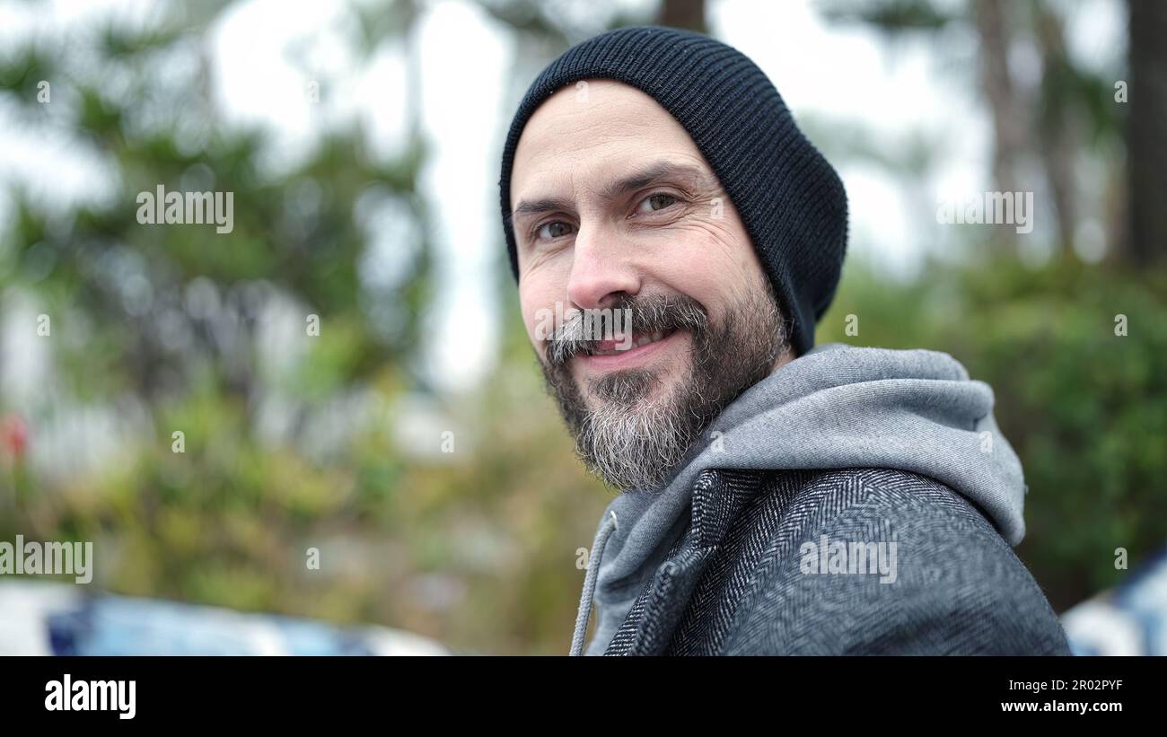 Young bald man smiling confident standing at park Stock Photo - Alamy