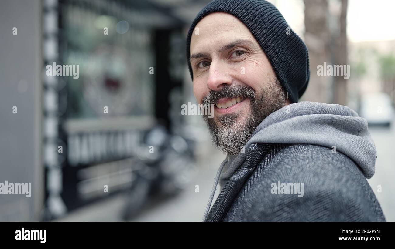 Young bald man smiling confident standing at street Stock Photo - Alamy