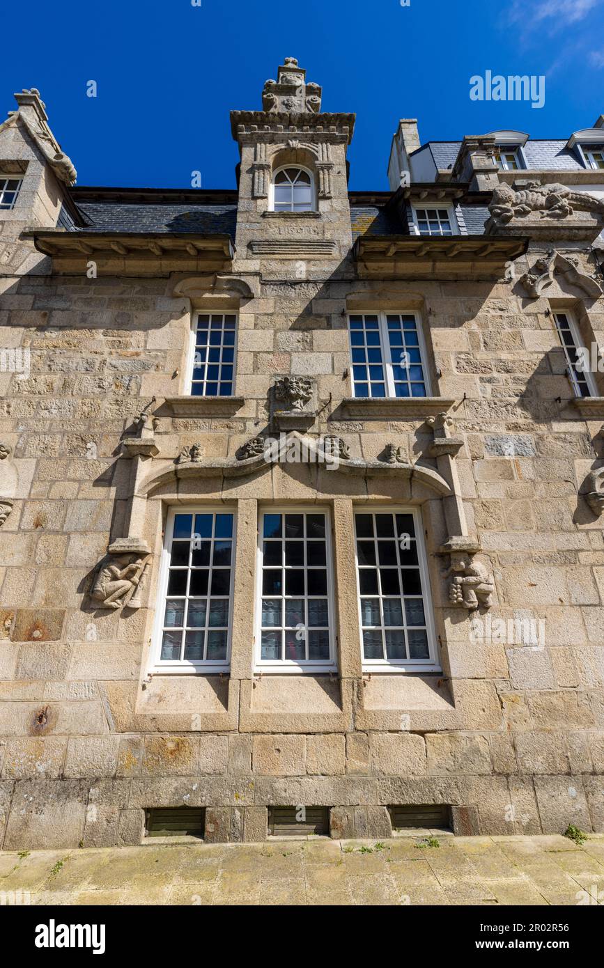 Ornate stone carvings on a house in the old quarter of Roscoff ...