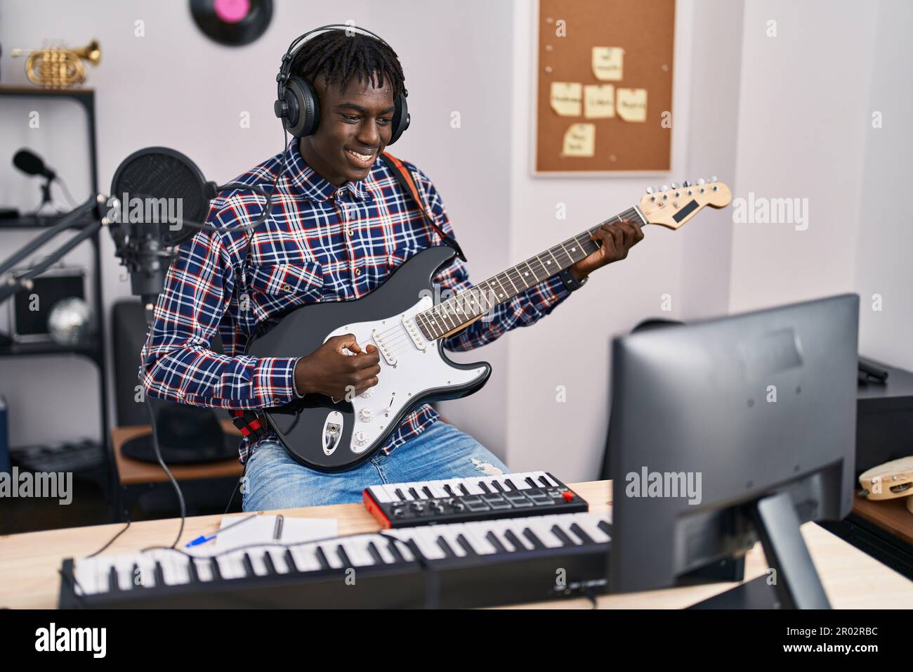African american man musician smiling confident playing electrical ...