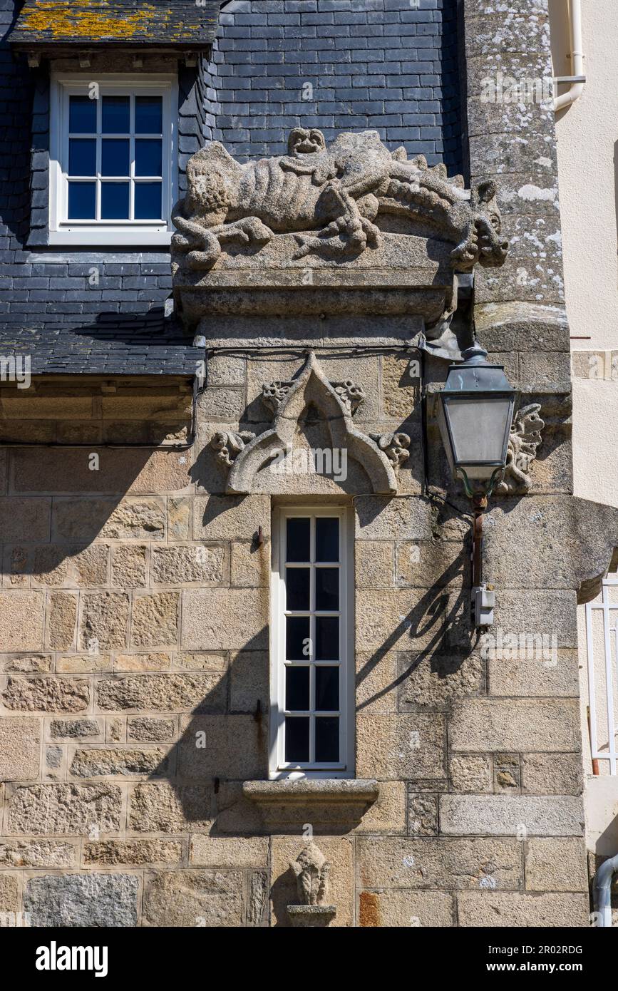 Ornate stone carvings on a house in the old quarter of Roscoff ...