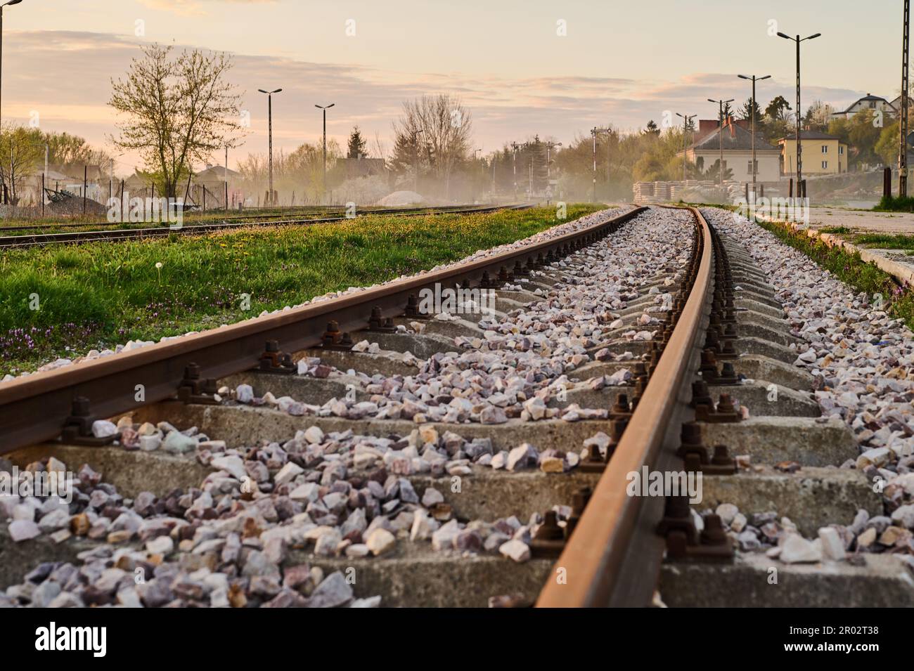 New railway rails on sleepers at a freight railway station Stock Photo ...