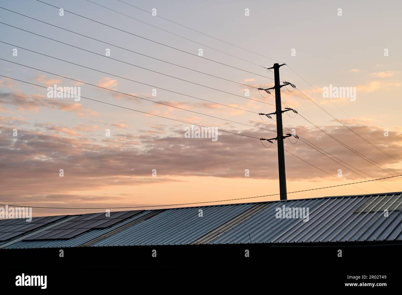 Crossing high-voltage wires against the sky Stock Photo - Alamy