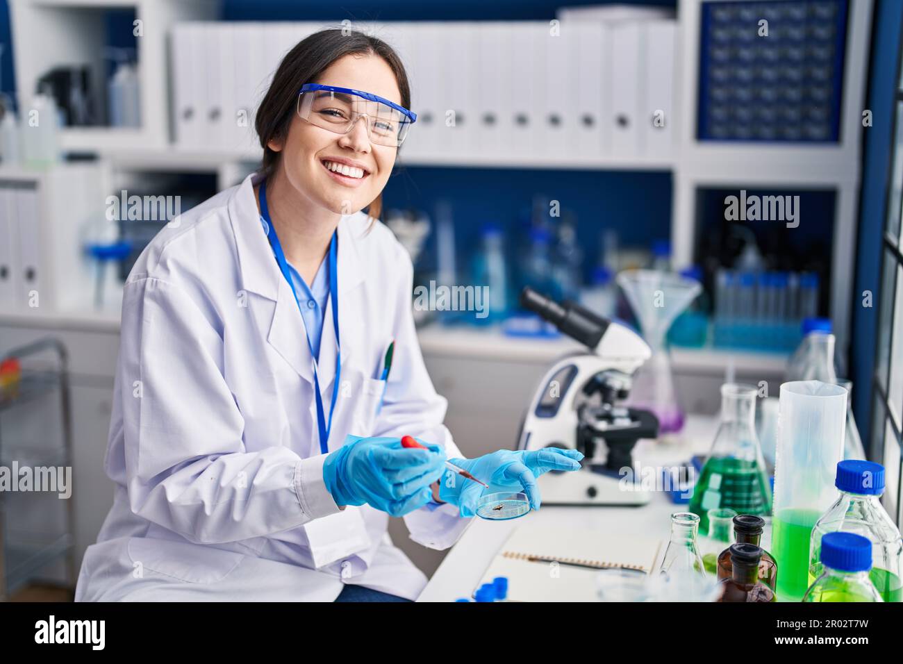 Young woman scientist analysing blood at laboratory Stock Photo - Alamy