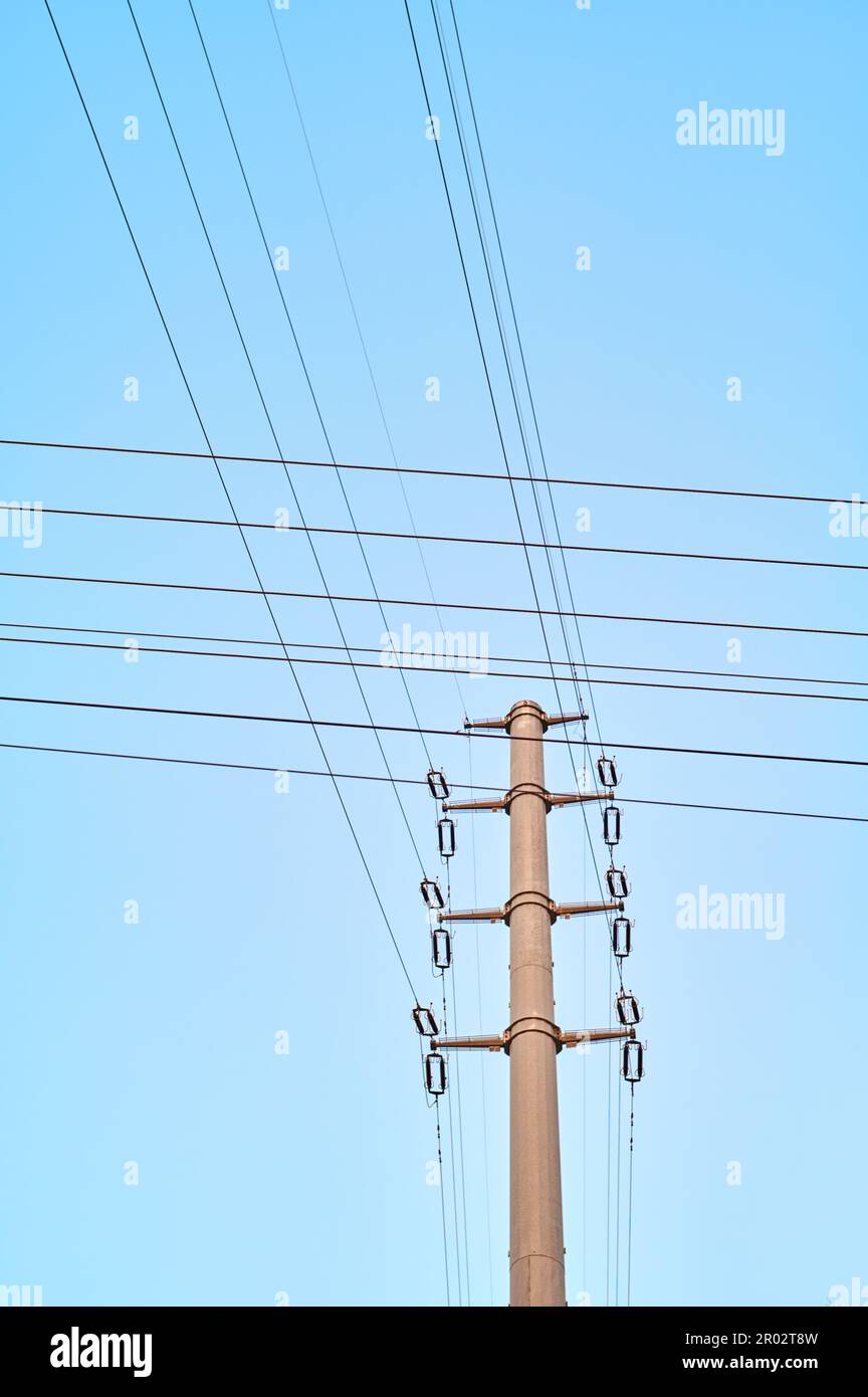 Crossing high-voltage wires against the sky Stock Photo - Alamy