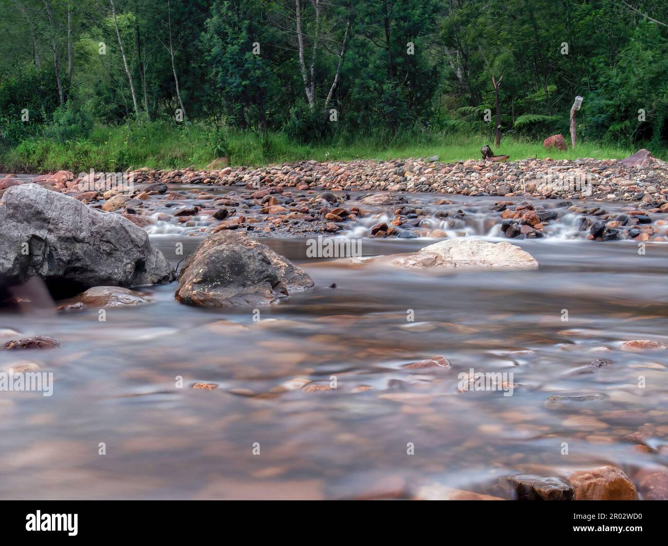 Long-exposure photography of the stream and rocks of Del Valle river, near the town of La Palma ...