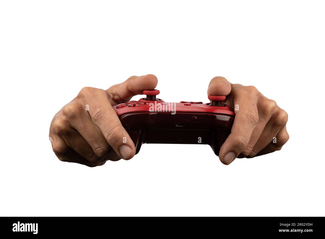 Male hand holding a red game controller isolated on white background ...