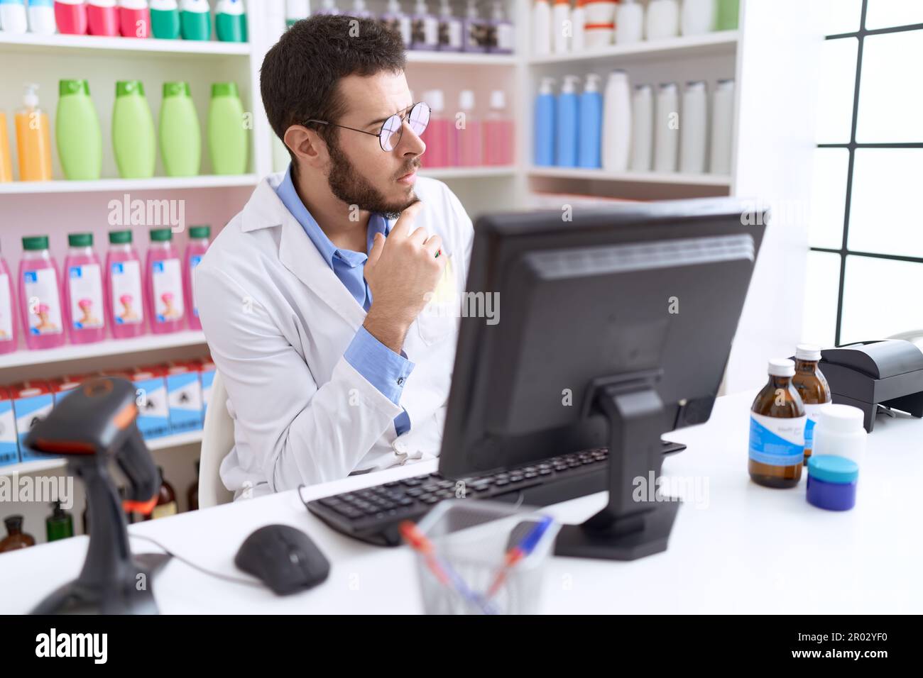 Young hispanic man pharmacist using hi-res stock photography and images ...