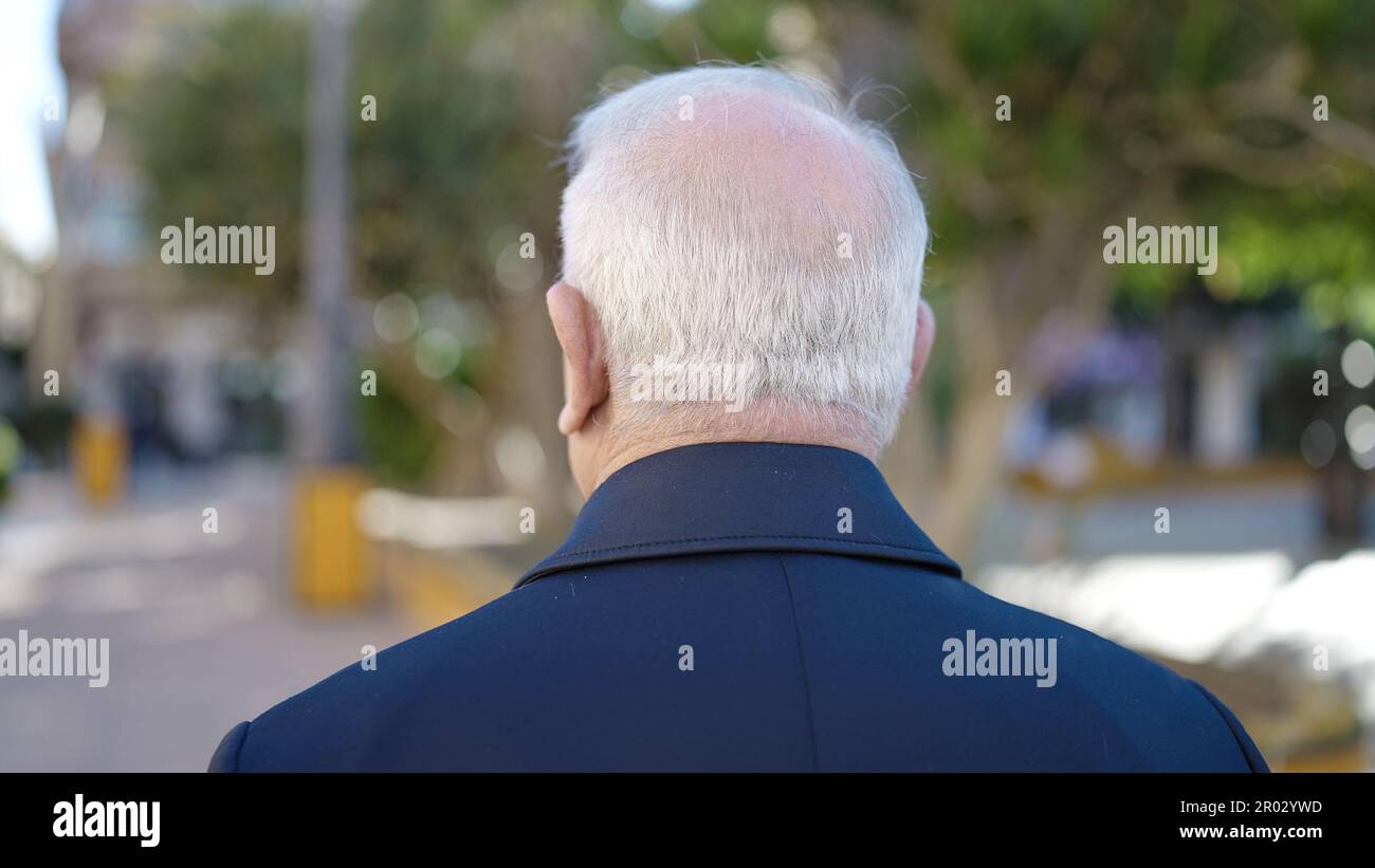 senior standing backwards at park Stock Photo - Alamy