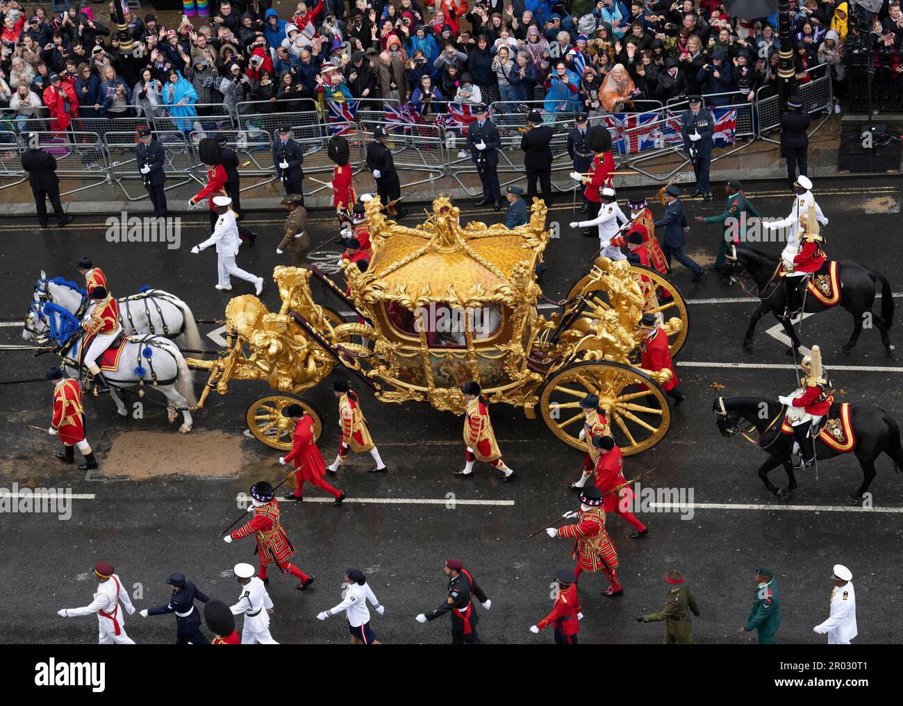 Britain's King Charles III and Queen Camilla travel in the Gold State ...