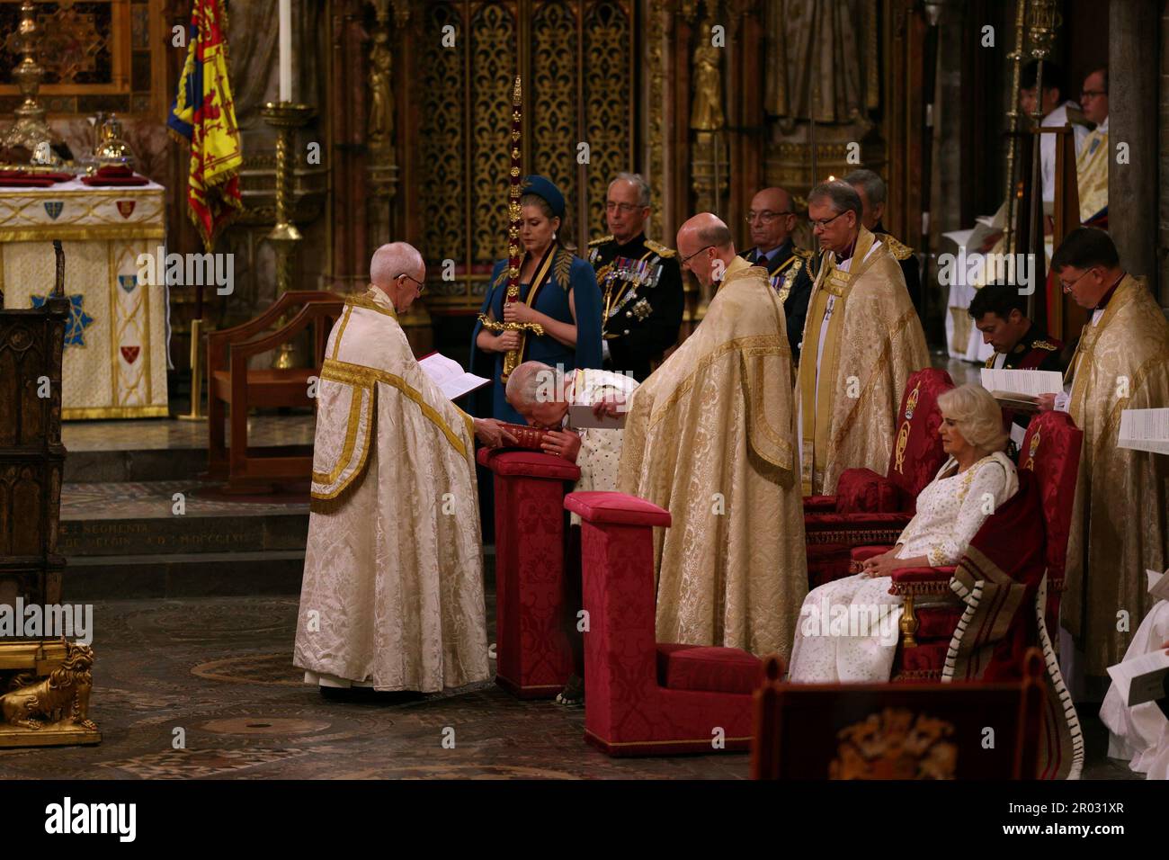 Britain's King Charles III kisses the Bible, with Camilla, the Queen ...