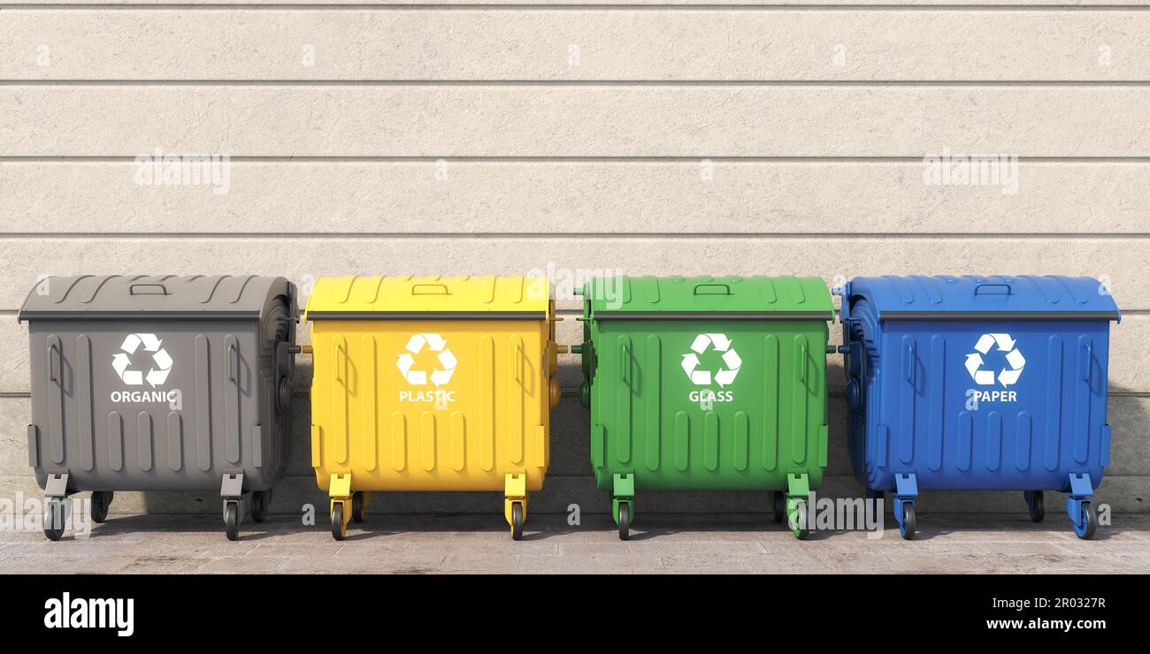 Garbage containers with separated garbage on a street. Trash bins for plastic, glass, paper and ...