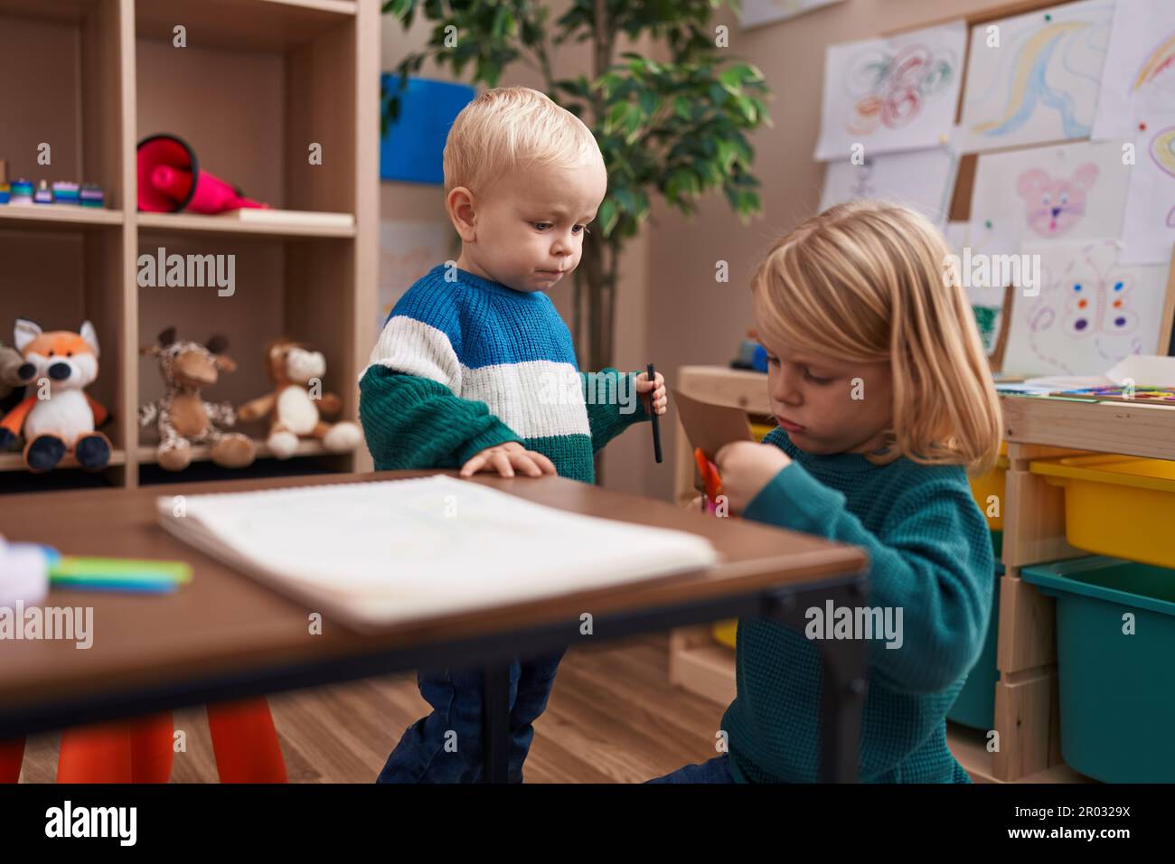 Adorable boy girl student cutting hi-res stock photography and images ...