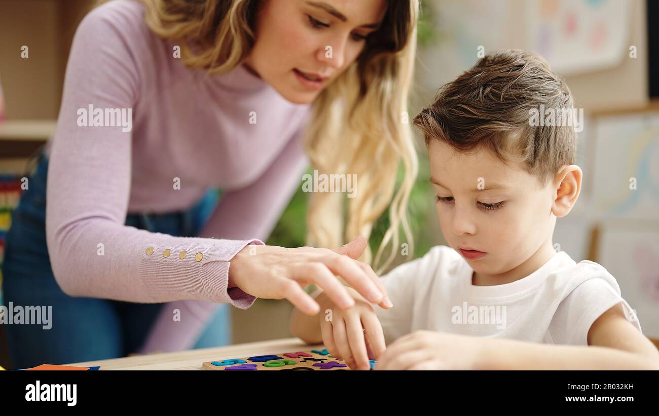 Woman boy playing maths puzzle hi-res stock photography and images - Alamy