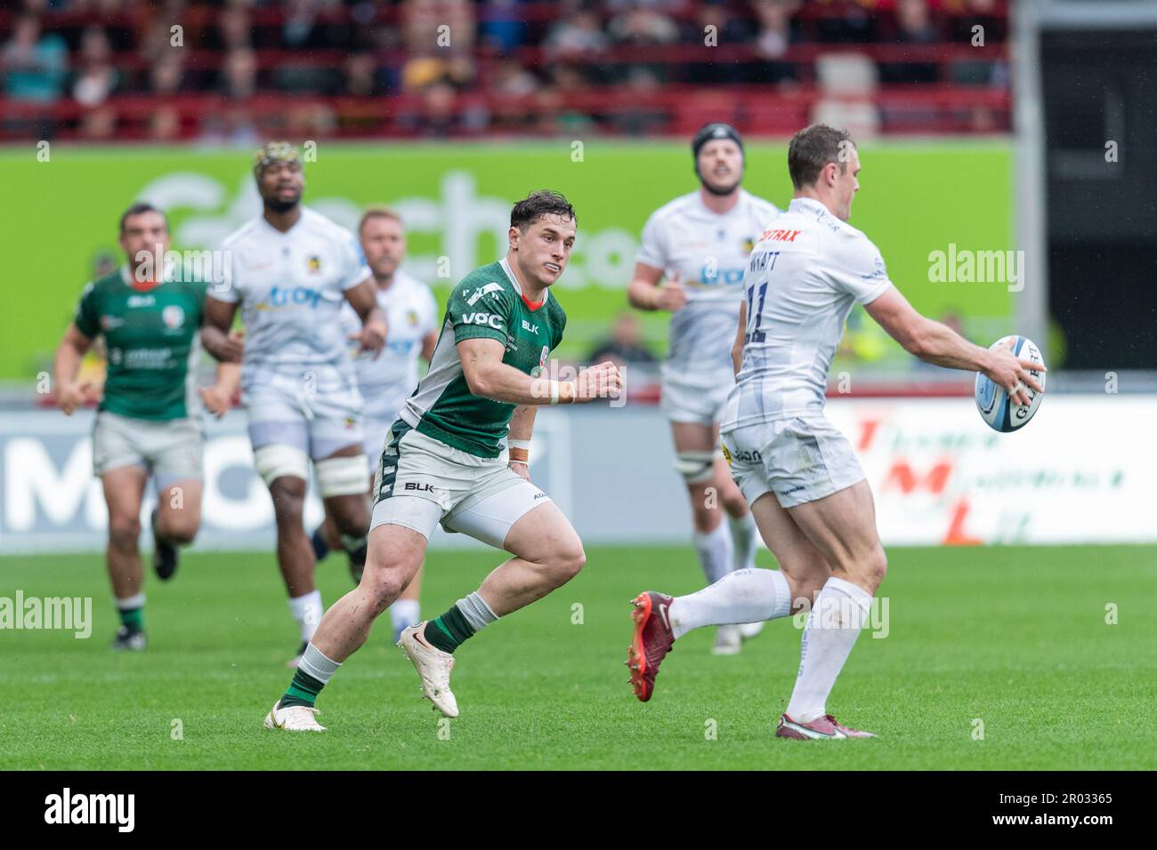 Tom Wyatt of Exeter Chiefs plays the ball as Henry Arundell of London ...