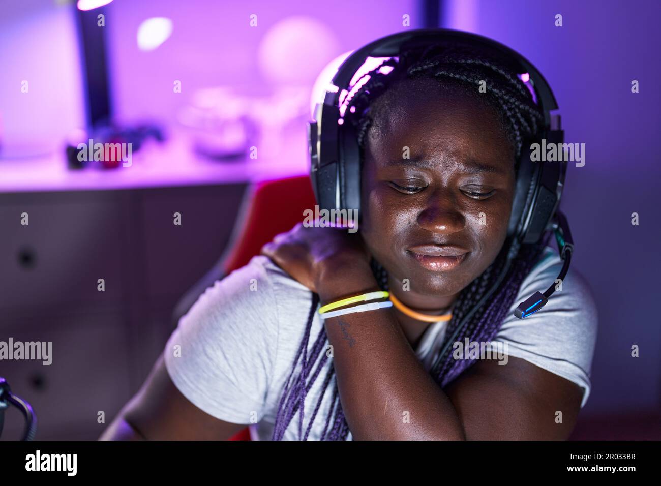 African american woman streamer stressed using computer at gaming room ...