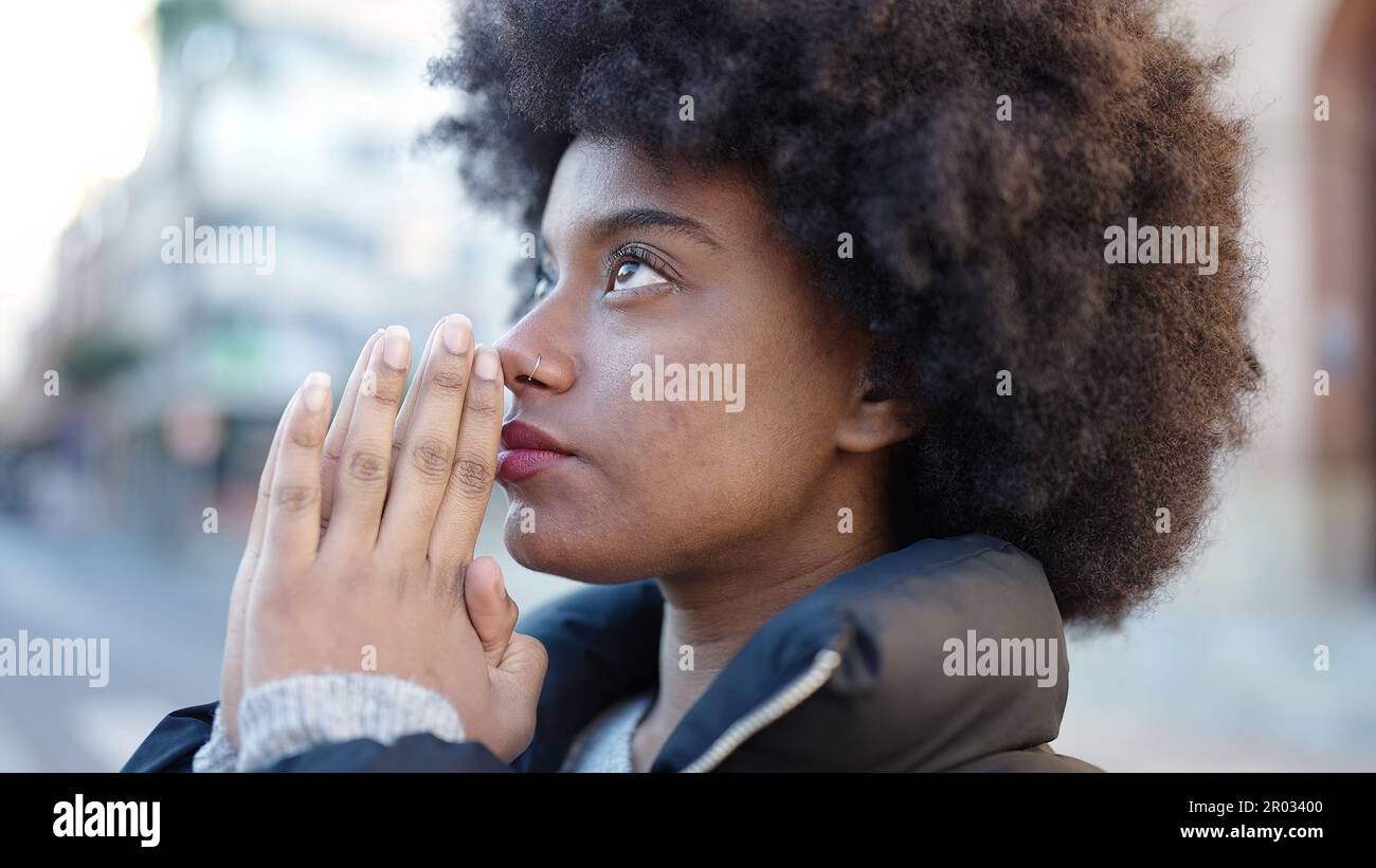 Beautiful african american woman praying hi-res stock photography and ...