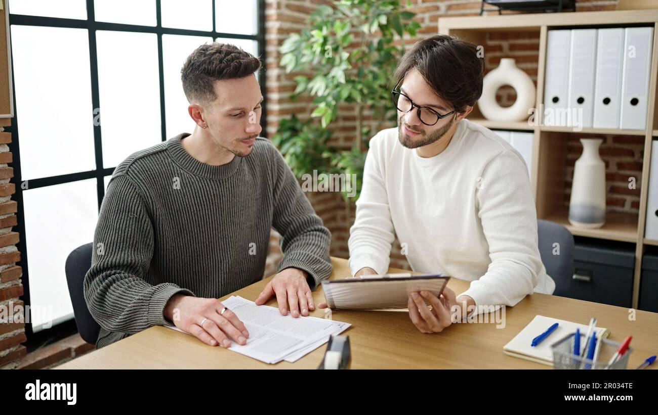 Two men business partners reading hi-res stock photography and images ...