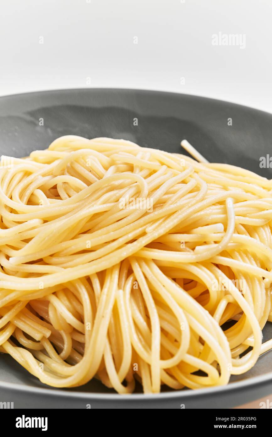 Delicious plate of italian spaghetti pasta over isolated white ...
