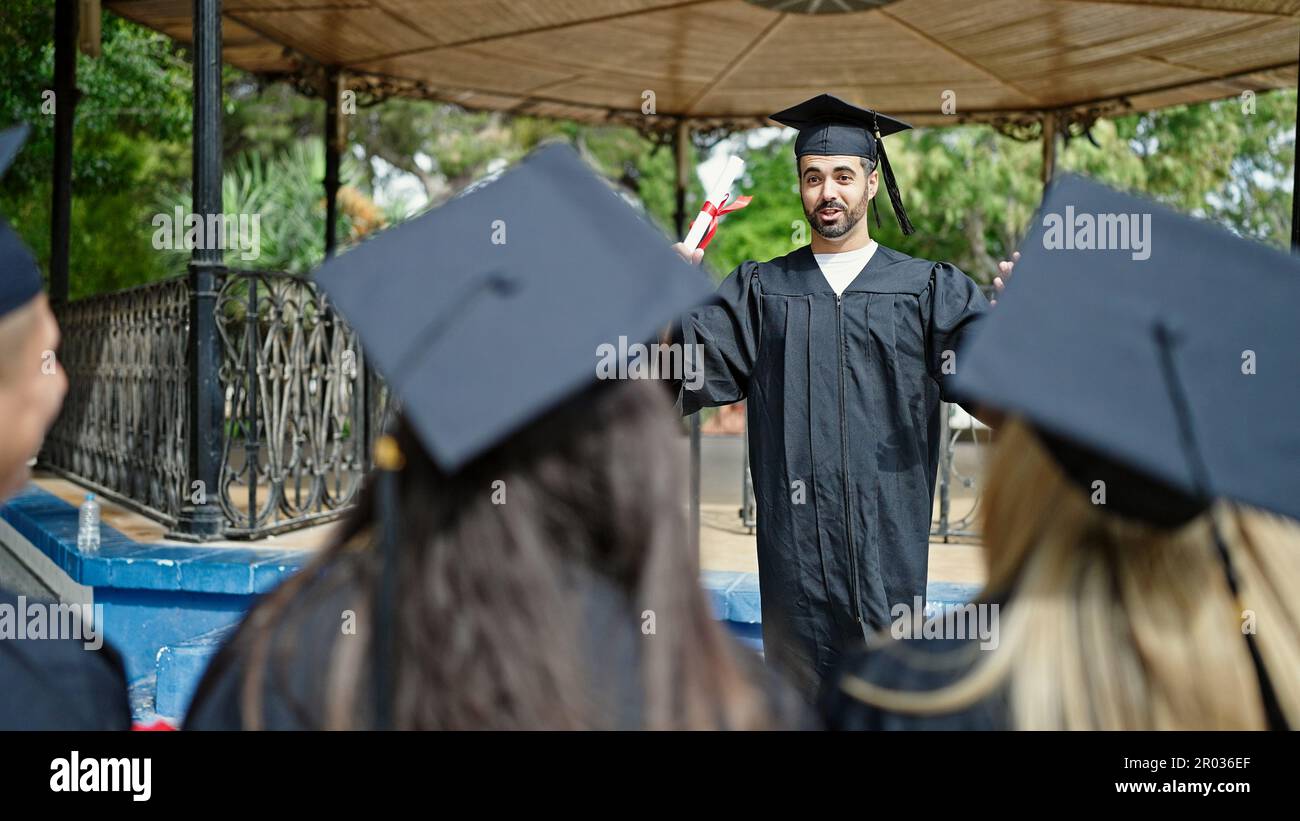 Group of people students graduated telling speech at university campus ...