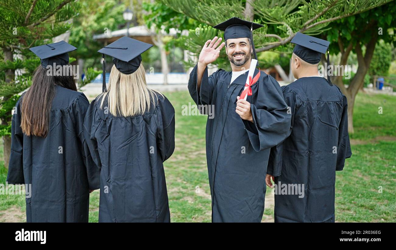 Group of people students graduated holding diploma saying hello with ...