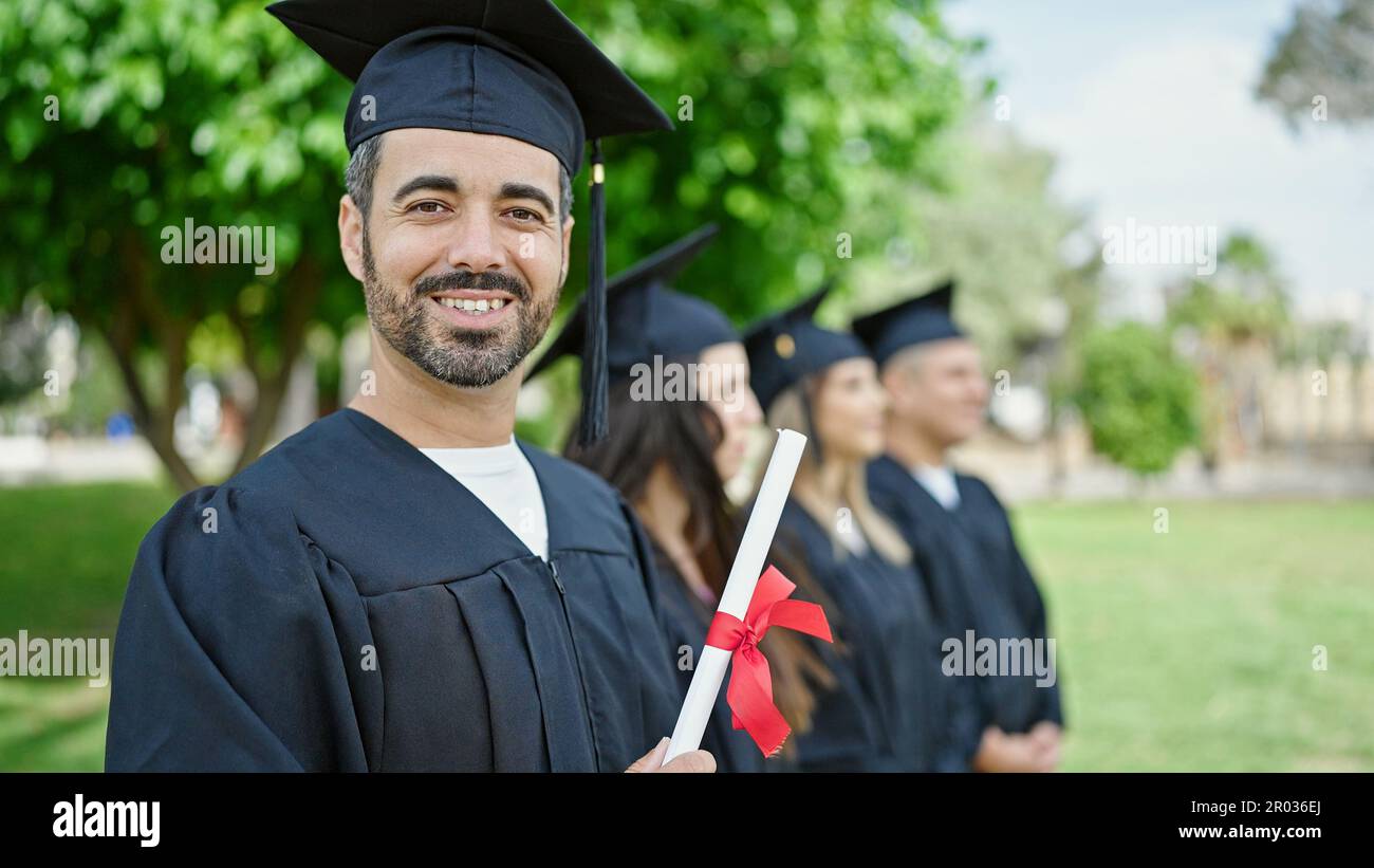 Group of people students graduated holding diploma at university campus ...