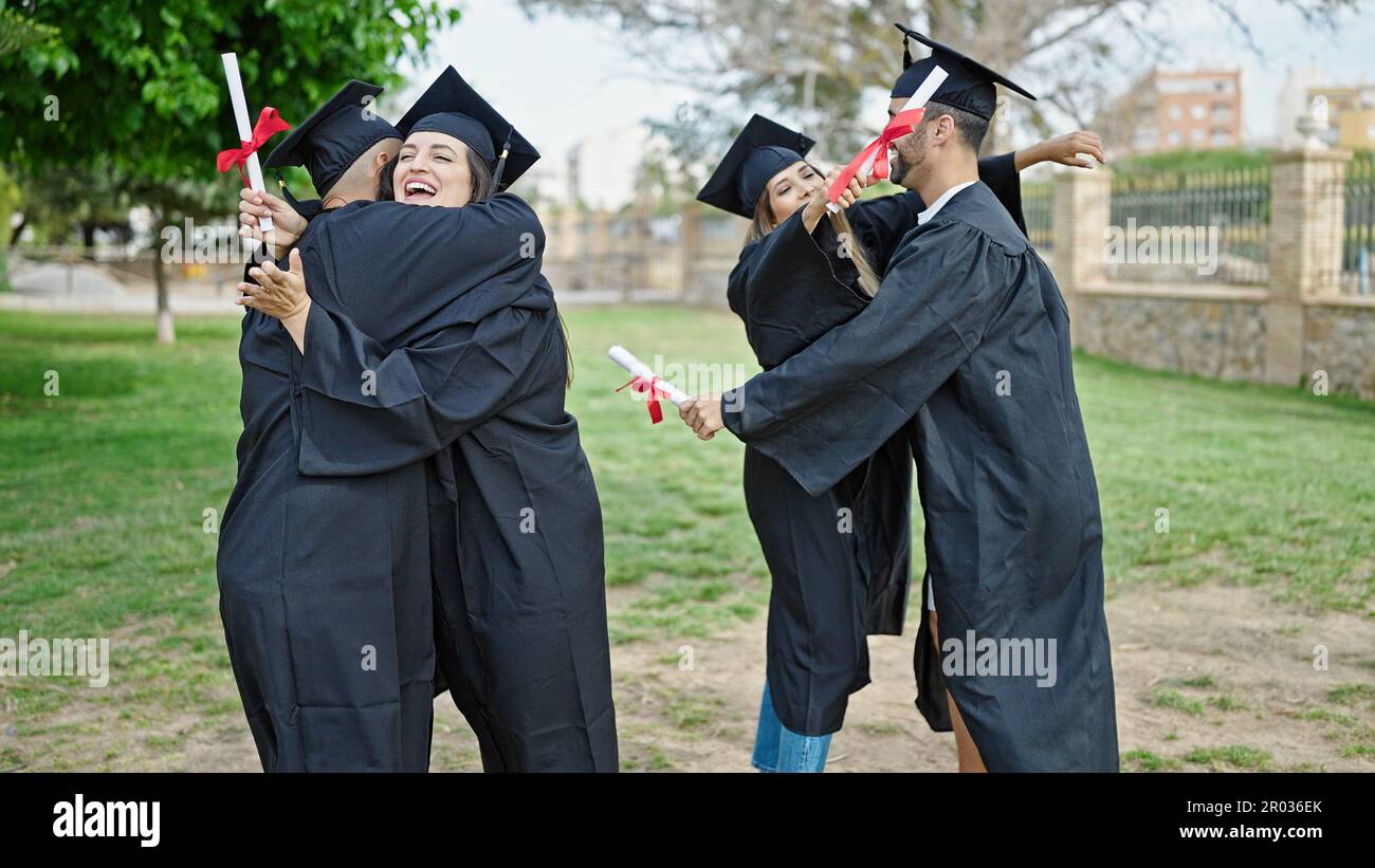 Group of people students graduated holding diploma hugging each other ...