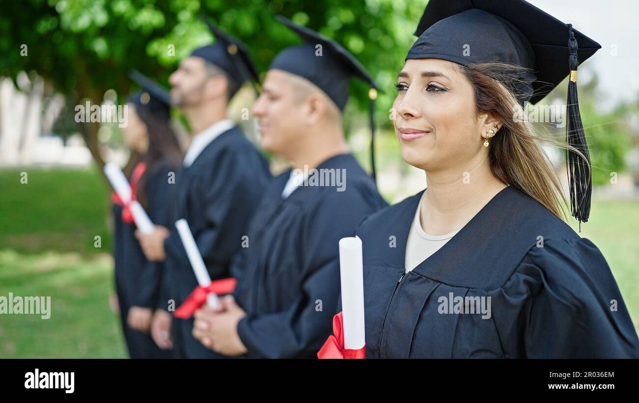 Group of people students graduated holding diploma at university campus ...