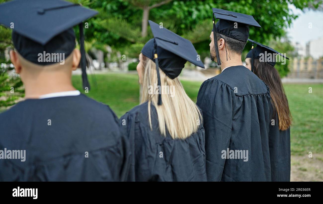 Group of people students graduated standing together backwards at ...