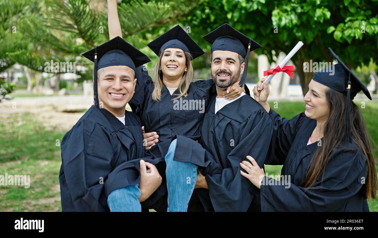 Group of people students graduated holding diploma hugging each other ...