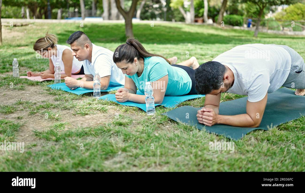 Group of people training abs exercise at park Stock Photo - Alamy