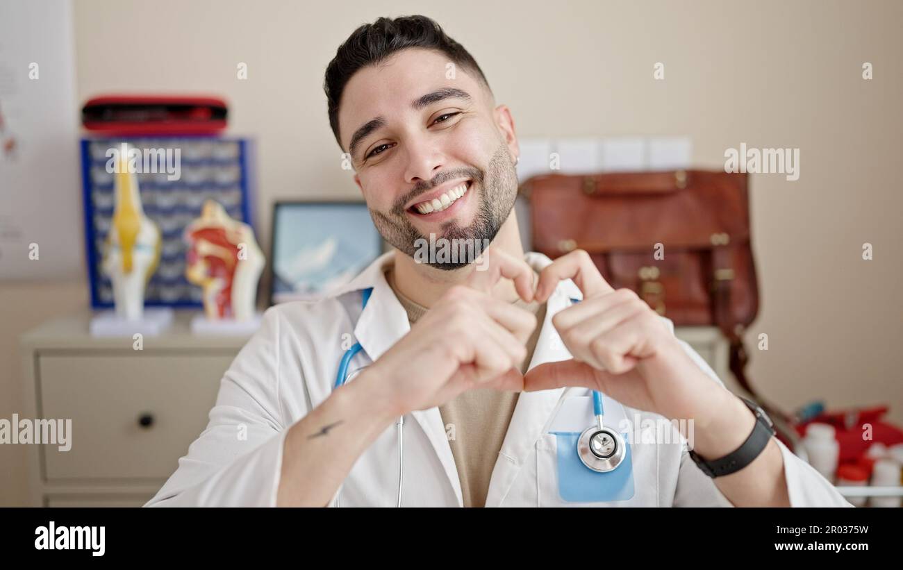 Doctor doing heart hands hi-res stock photography and images - Alamy