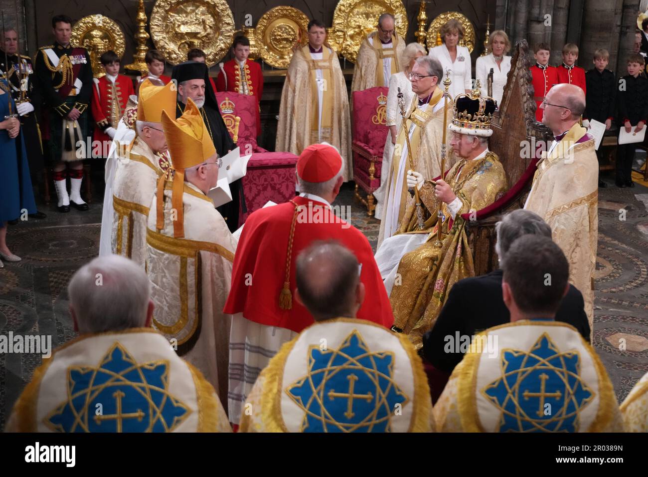 King Charles III, crowned with St Edward's Crown, surrounded by faith ...