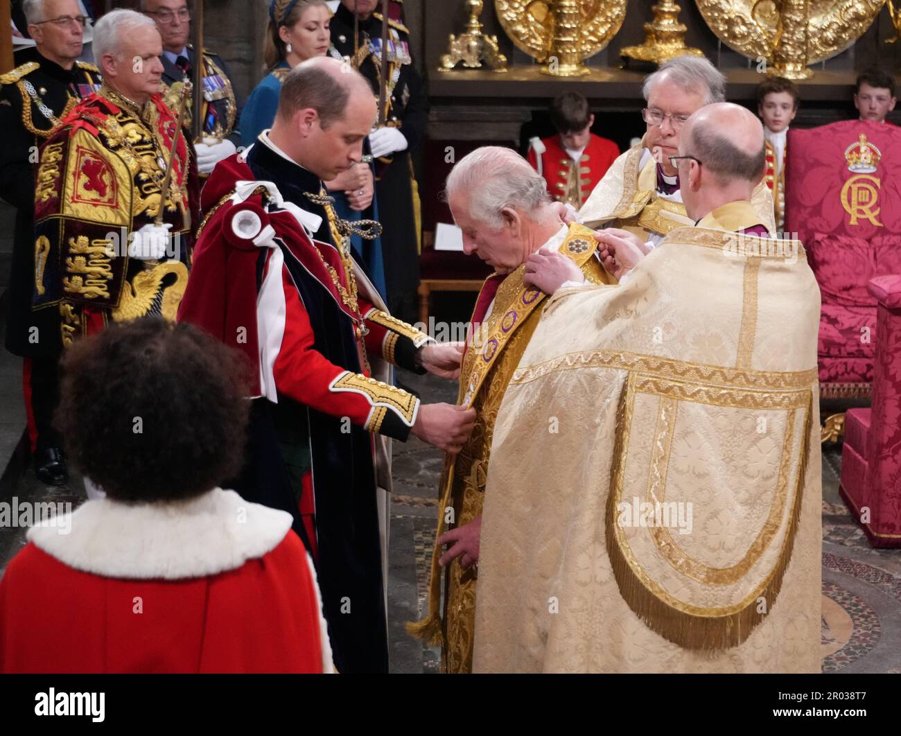 The Prince of Wales places the Stole Royal on his father King Charles ...